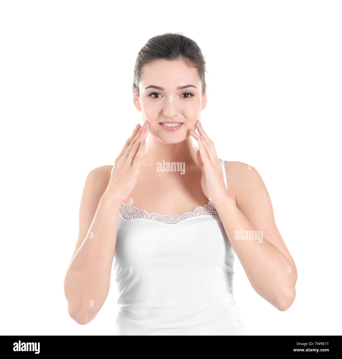 Attractive young woman with silky skin after applying cream on white ...