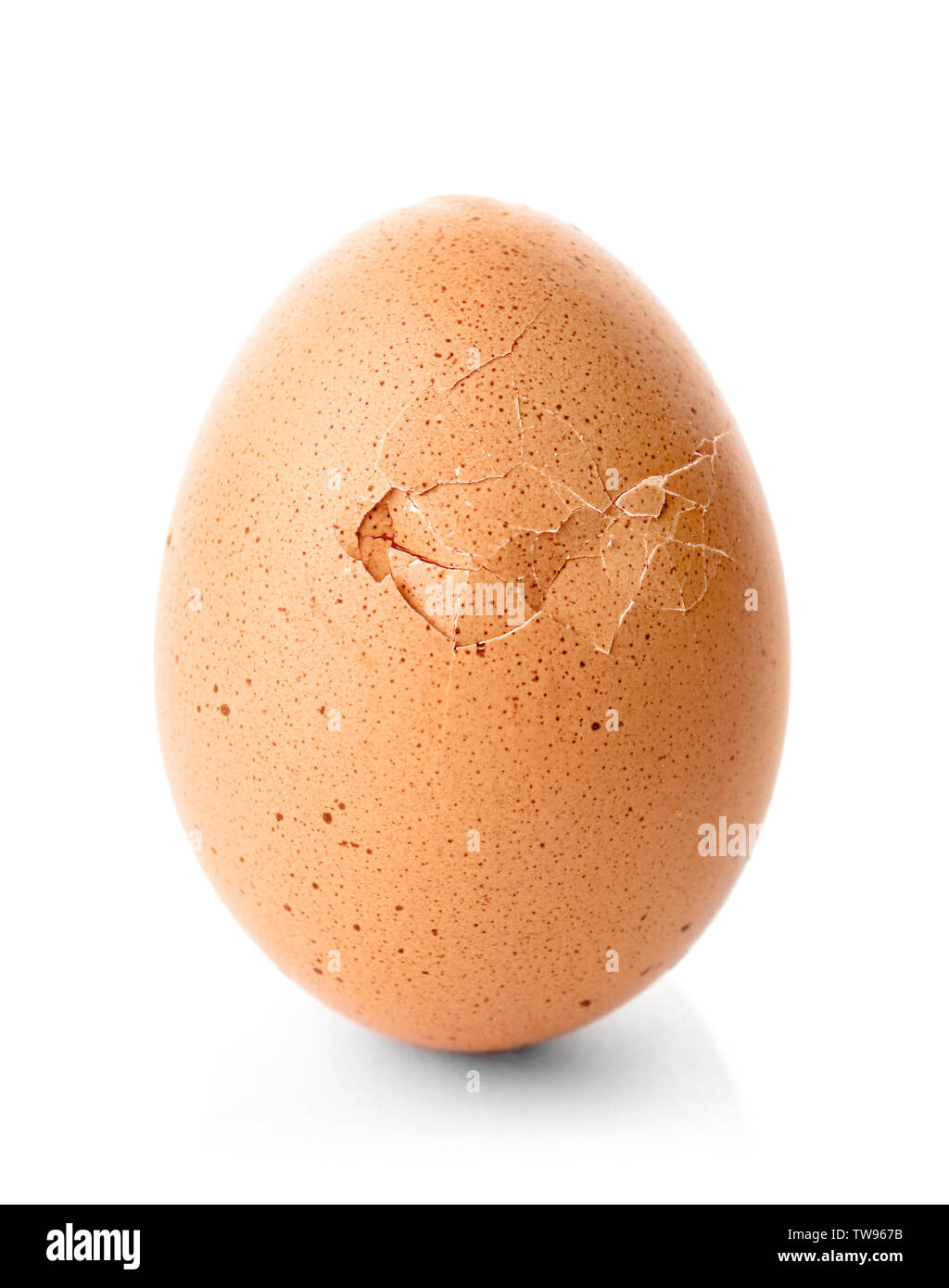 Cracked chicken egg on white background Stock Photo - Alamy