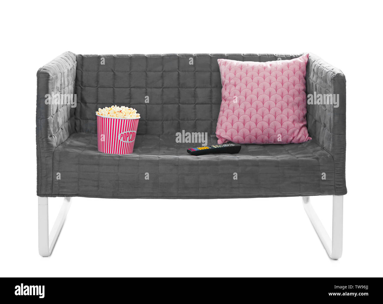 Comfortable sofa with popcorn and TV remote control on white background ...