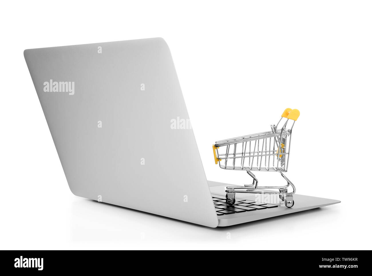 Laptop and small shopping cart on white background. Internet shopping ...