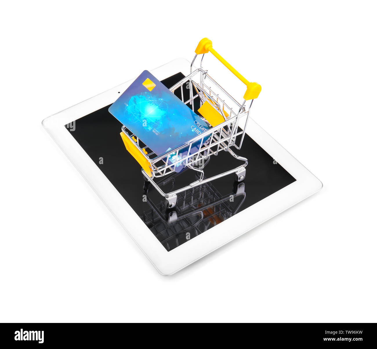 Tablet computer and small shopping trolley with credit card on white ...