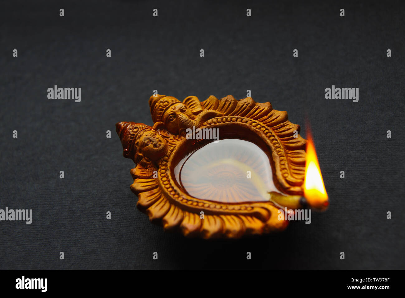 Burning diya lamp hi-res stock photography and images - Alamy