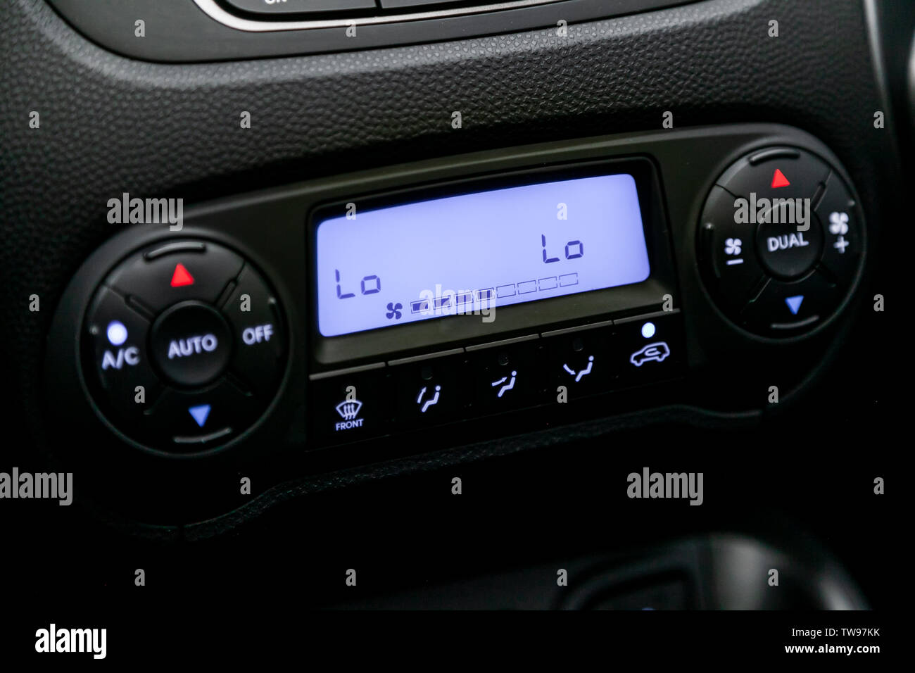 Black detail with the air conditioning button, the dashboard with ...