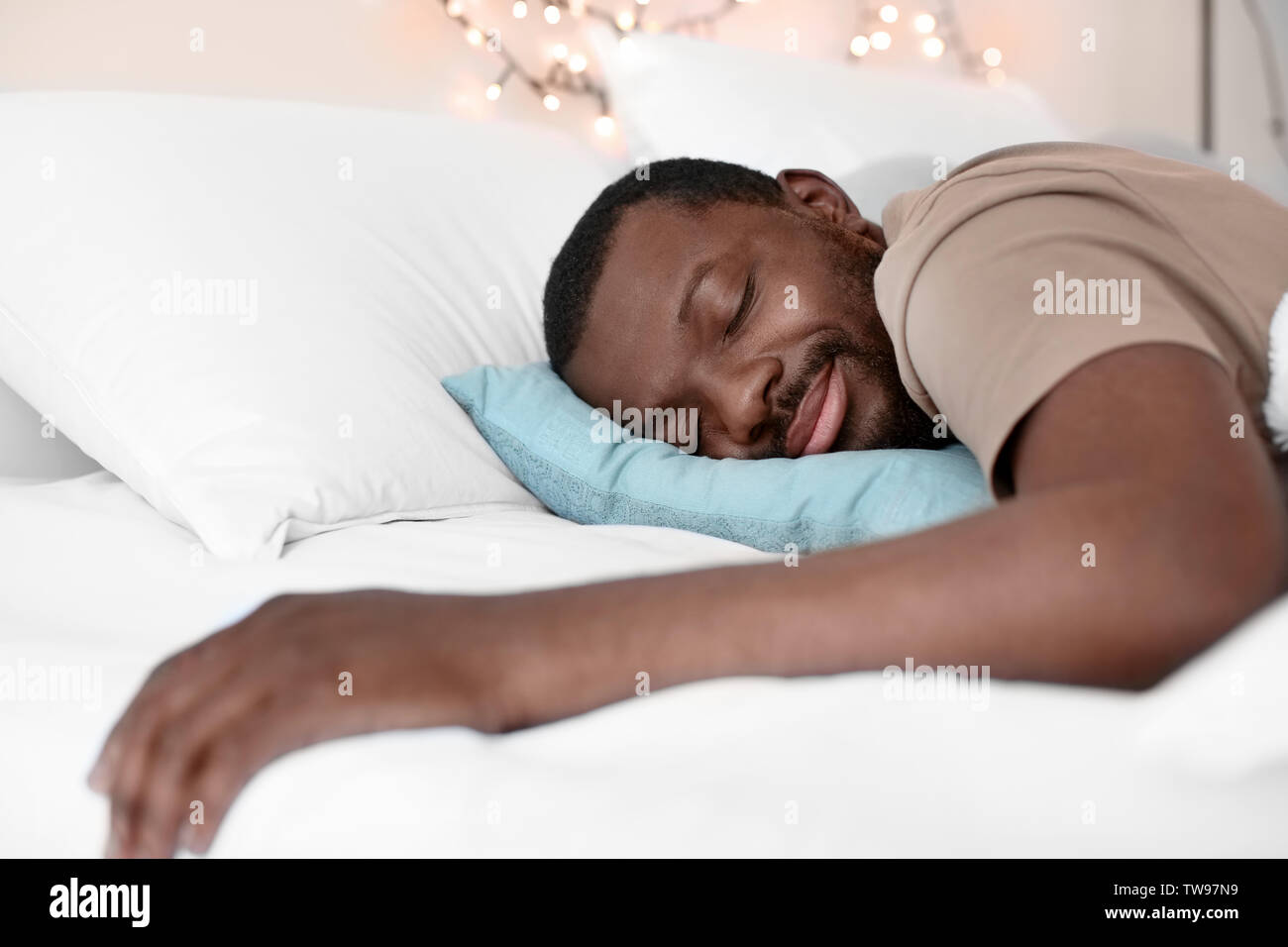 African American man sleeping in bed Stock Photo - Alamy