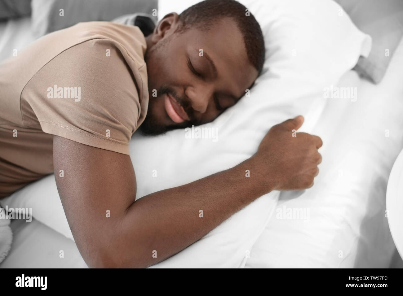 African American Man Sleeping In Bed High Resolution Stock Photography ...