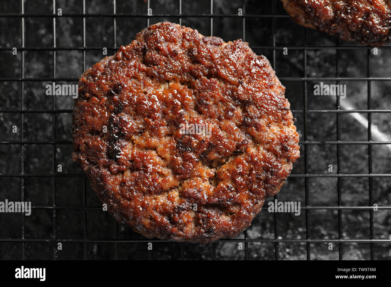 Burger patty on grill, closeup Stock Photo - Alamy