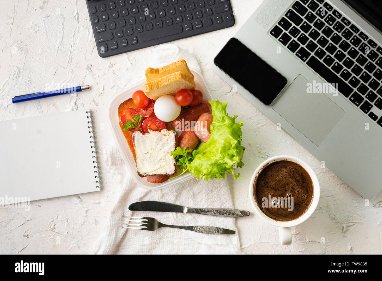 top view of the office work place with computer or laptop pen and phone ...