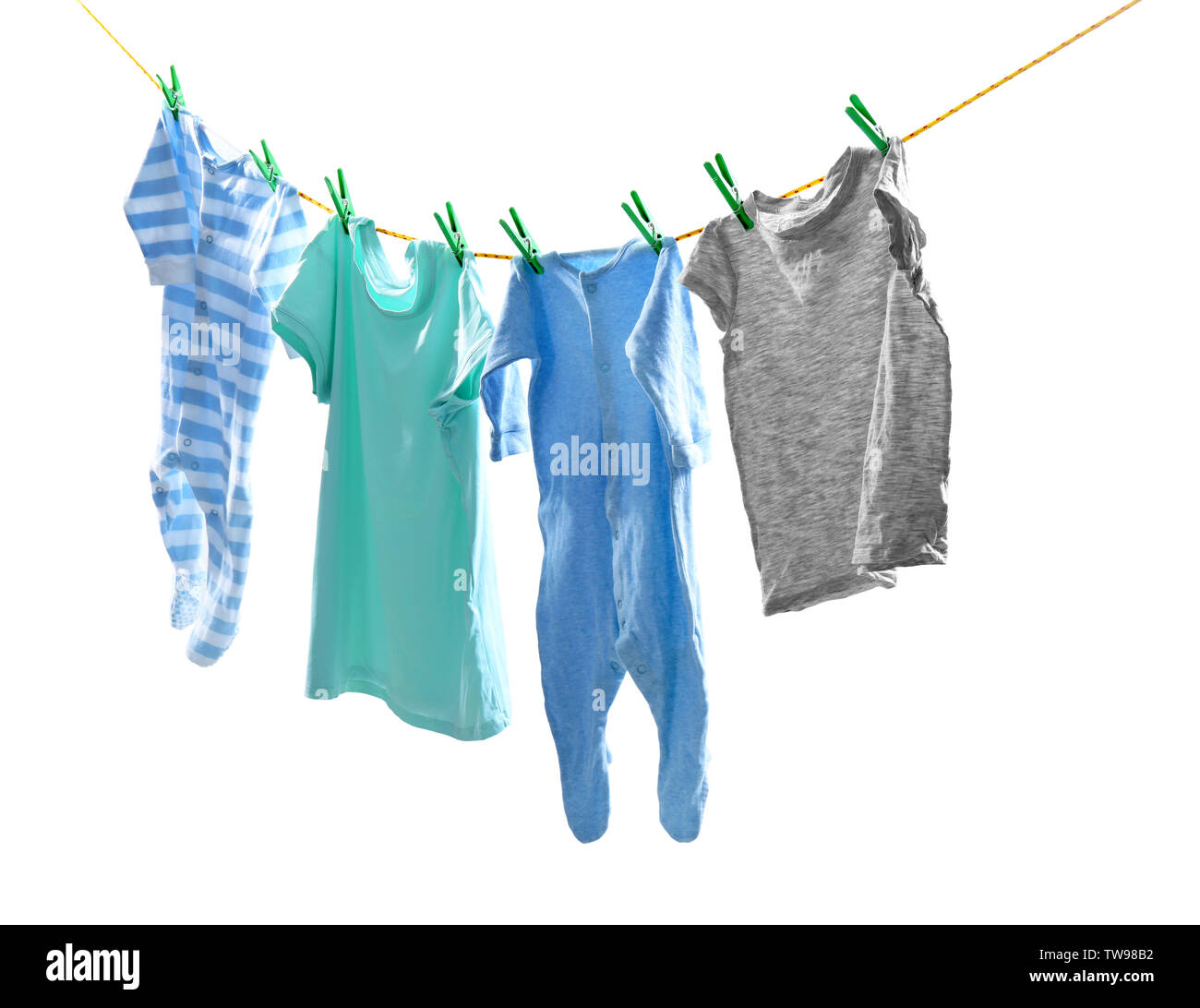 Children's clothes on laundry line against white background Stock Photo ...