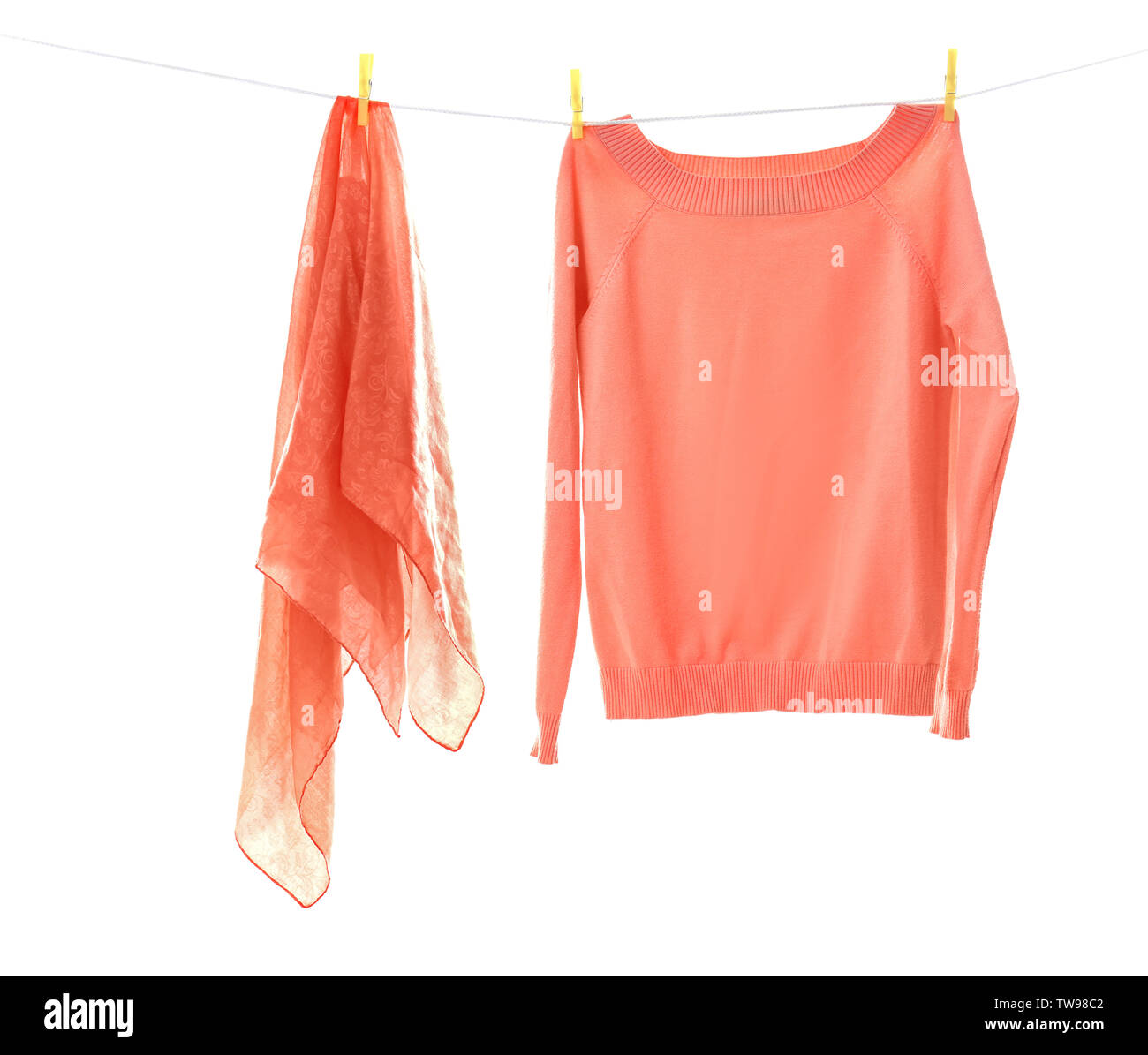 Clothes on laundry line against white background Stock Photo - Alamy