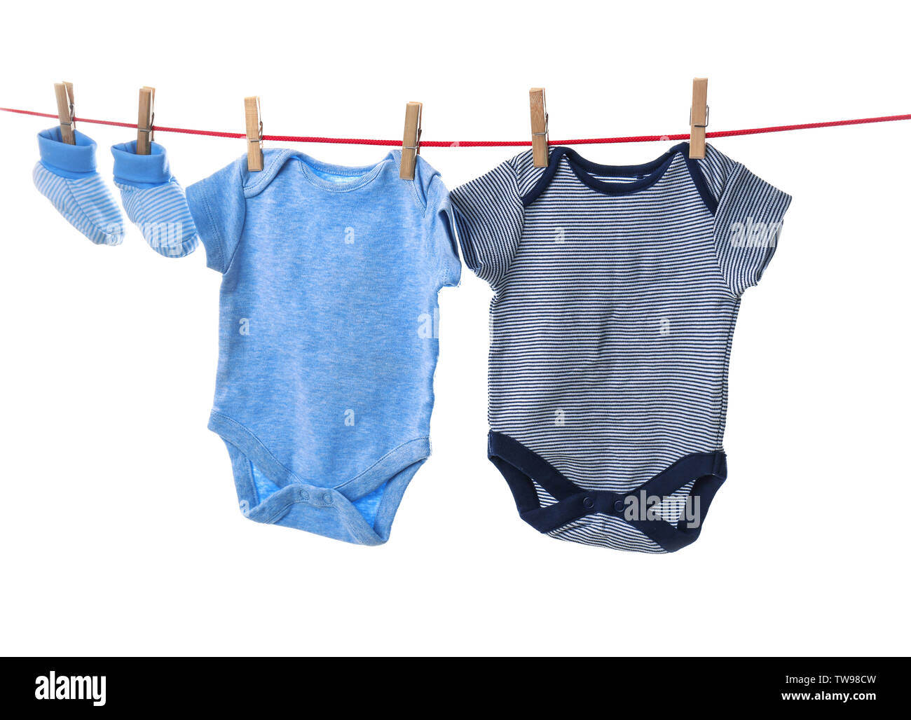 Children's clothes on laundry line against white background Stock Photo ...