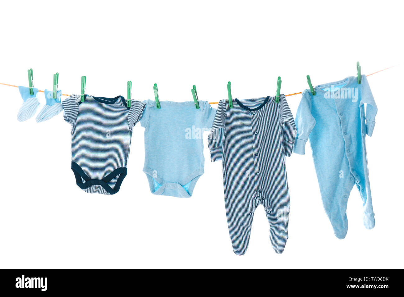 Children's clothes on laundry line against white background Stock Photo ...