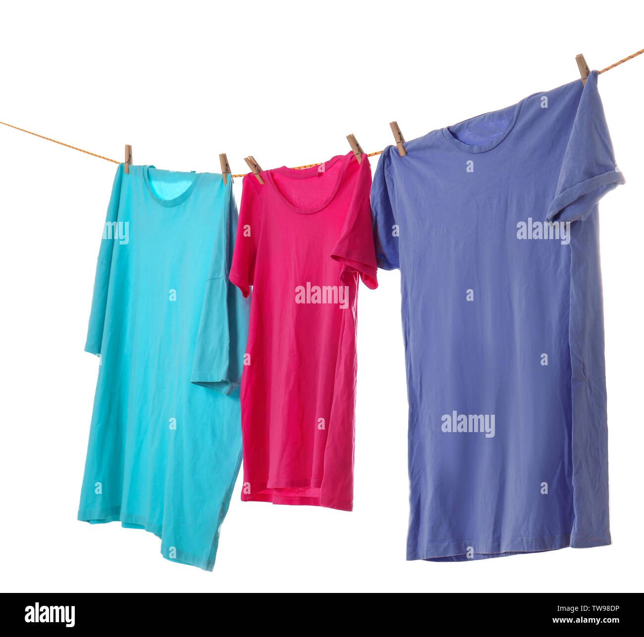 Clothes on laundry line against white background Stock Photo - Alamy