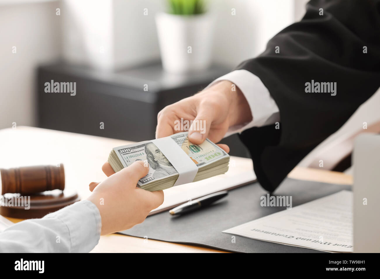 Judge taking bribe from woman, closeup Stock Photo - Alamy