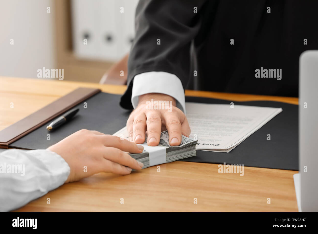 Judge taking bribe from woman, closeup Stock Photo - Alamy