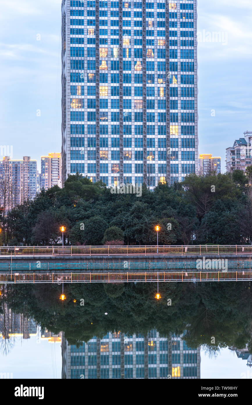 Modern office building near water Stock Photo - Alamy