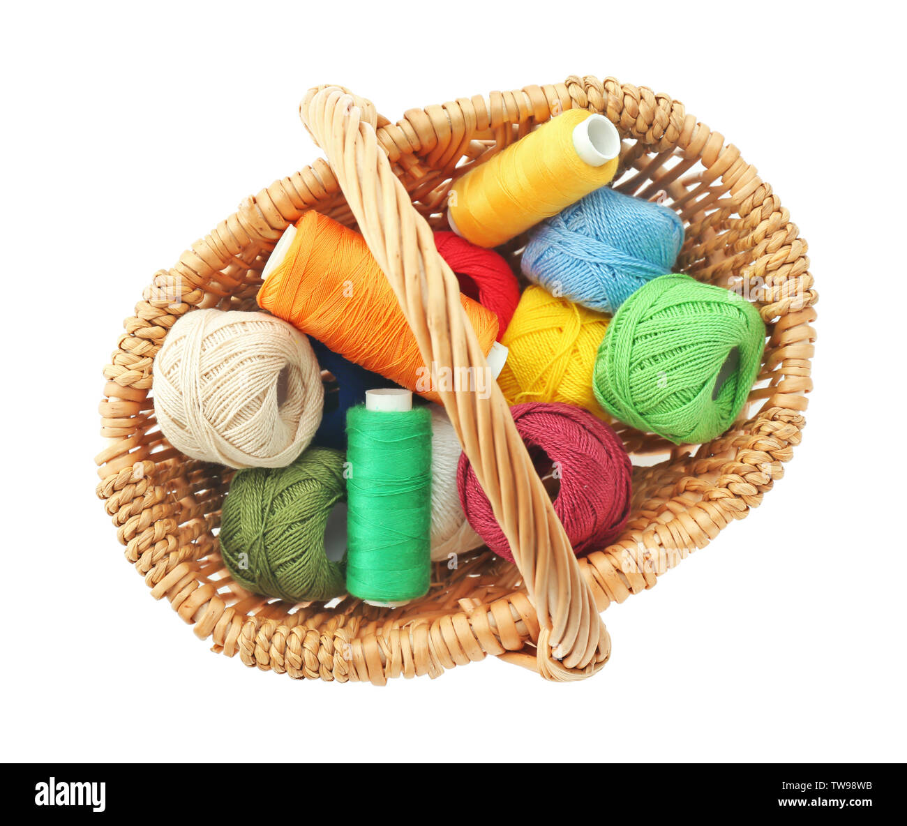 Wicker basket with colorful sewing threads on white background Stock ...