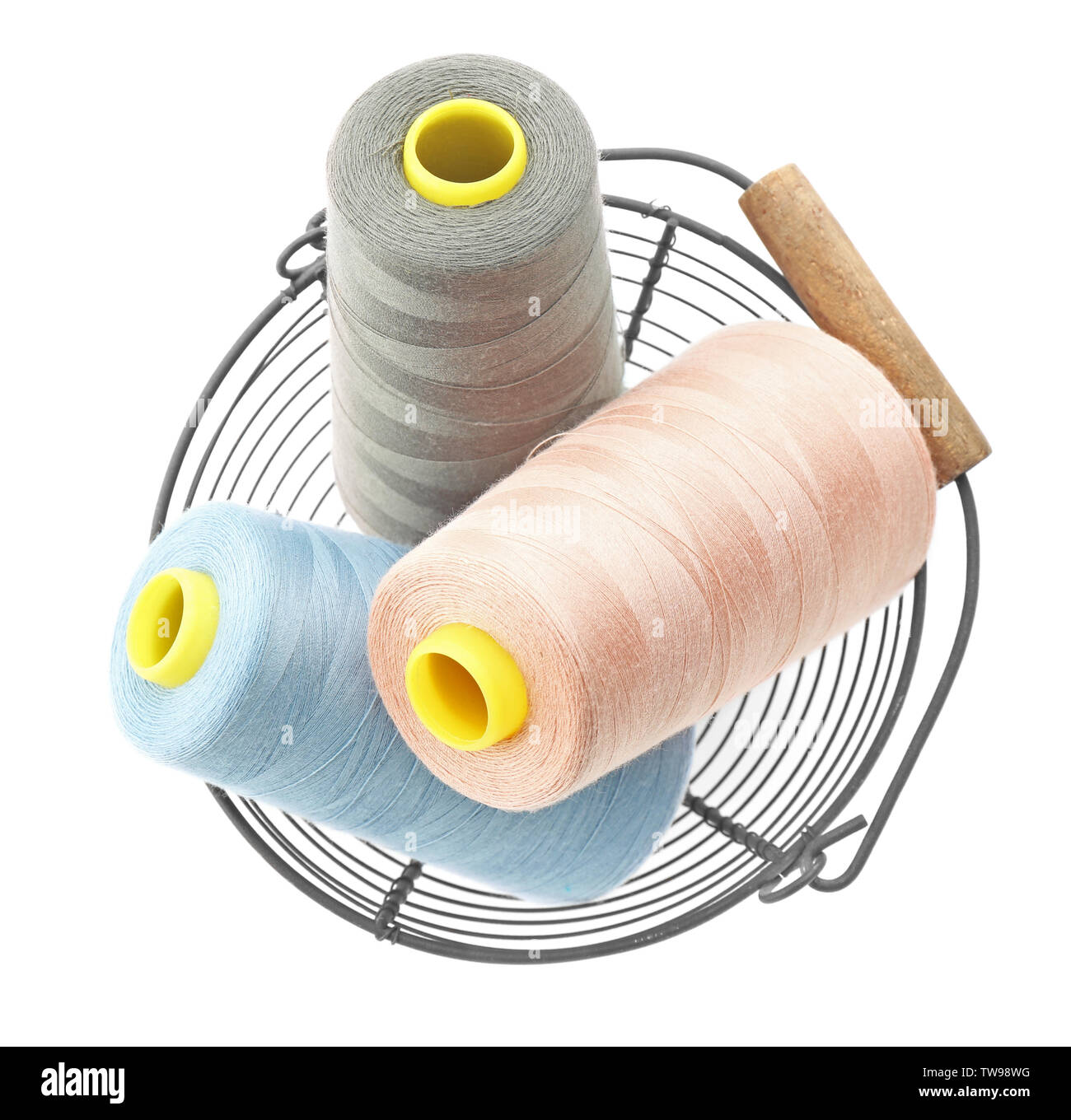 Metal basket with colorful sewing threads on white background Stock ...