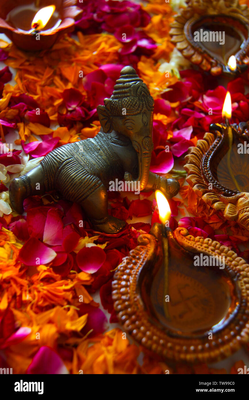 Statue of Lord Ganesha with diwali diyas Stock Photo - Alamy
