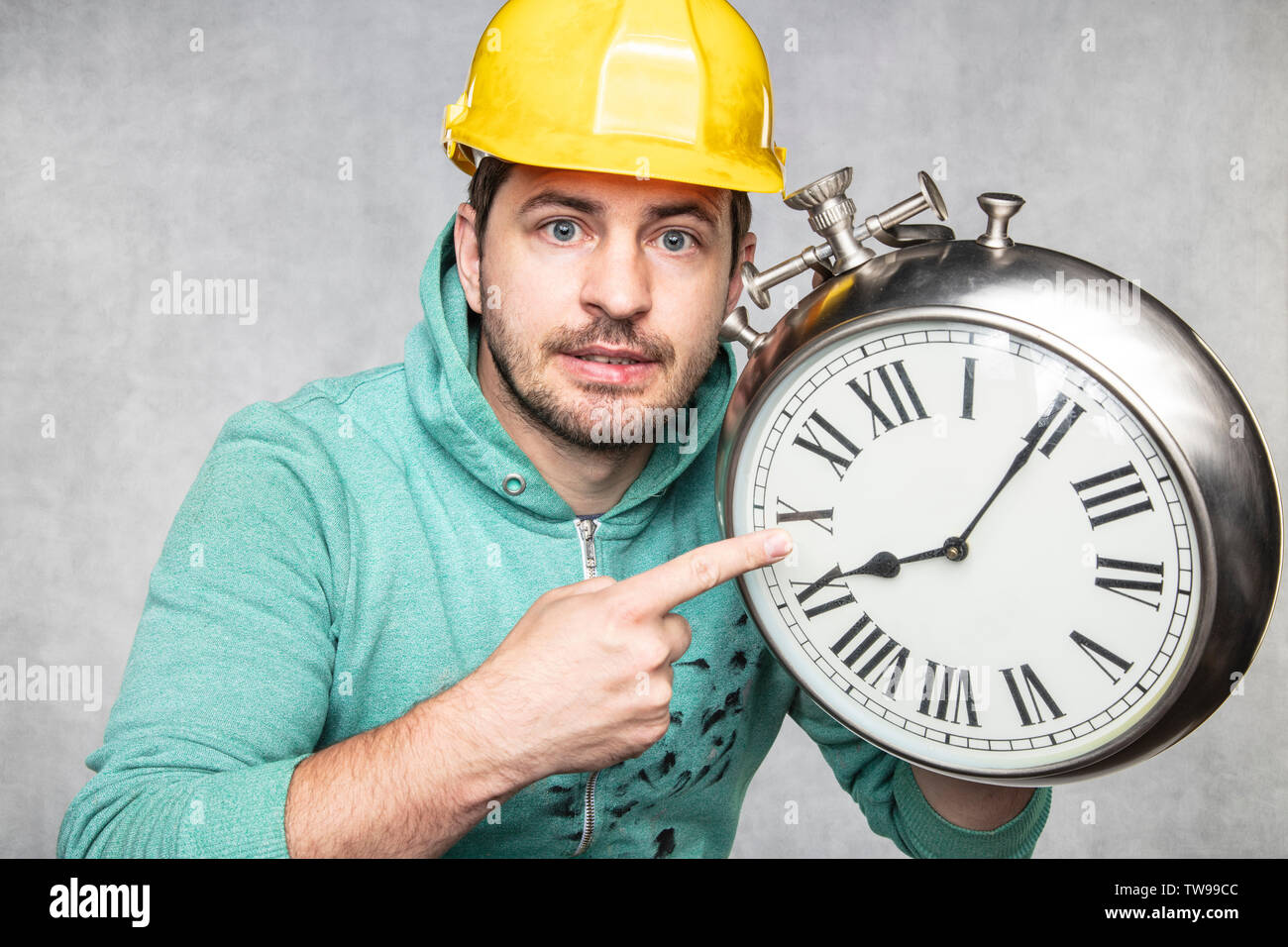 concept of time in matters of construction, builder and clock Stock ...