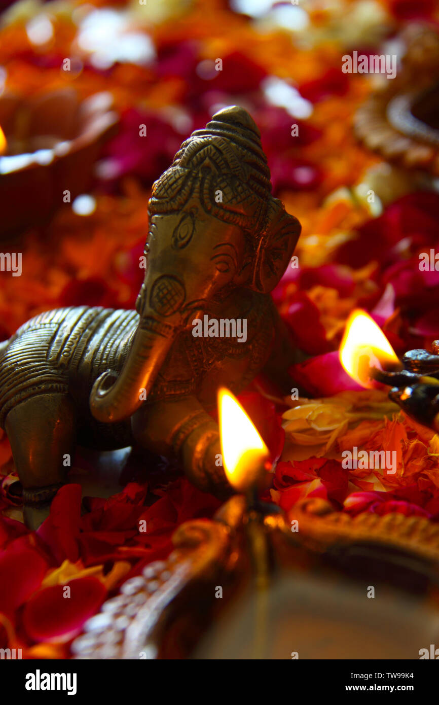 Statue of Lord Ganesha with diwali diyas Stock Photo - Alamy
