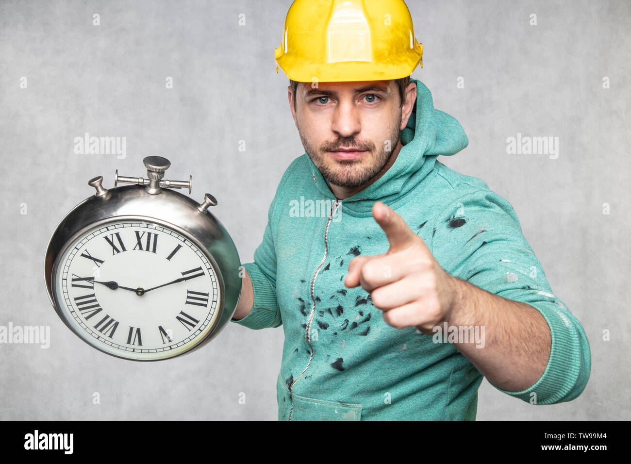concept of time in matters of construction, builder and clock Stock ...
