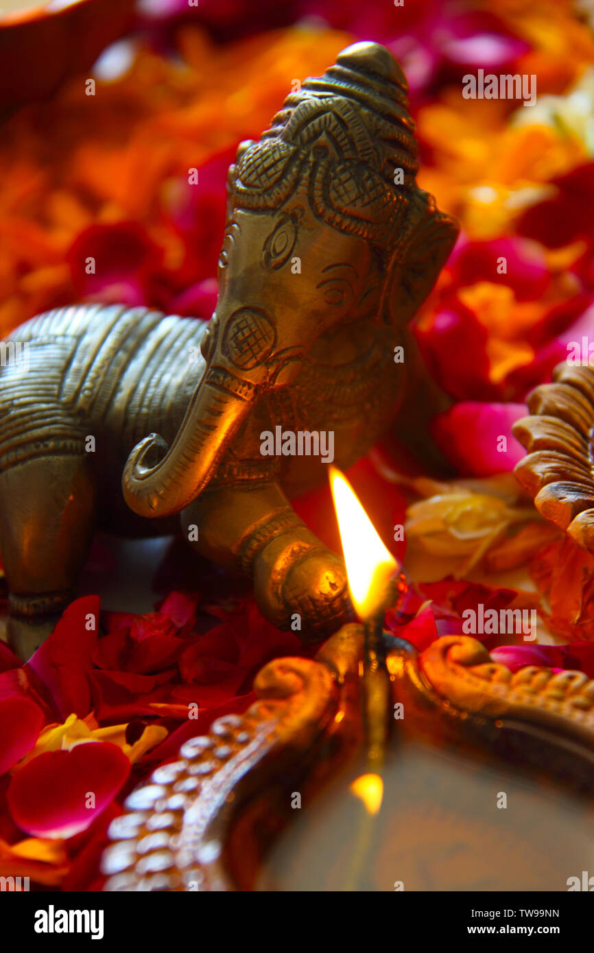 Statue of Lord Ganesha with diwali diyas Stock Photo - Alamy