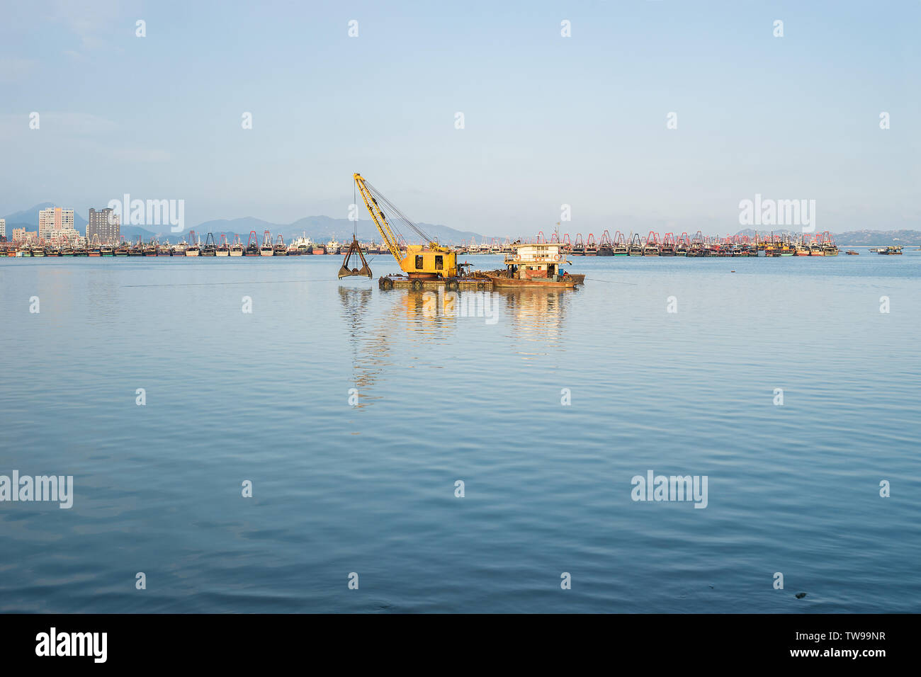 A dredging ship in operation Stock Photo - Alamy