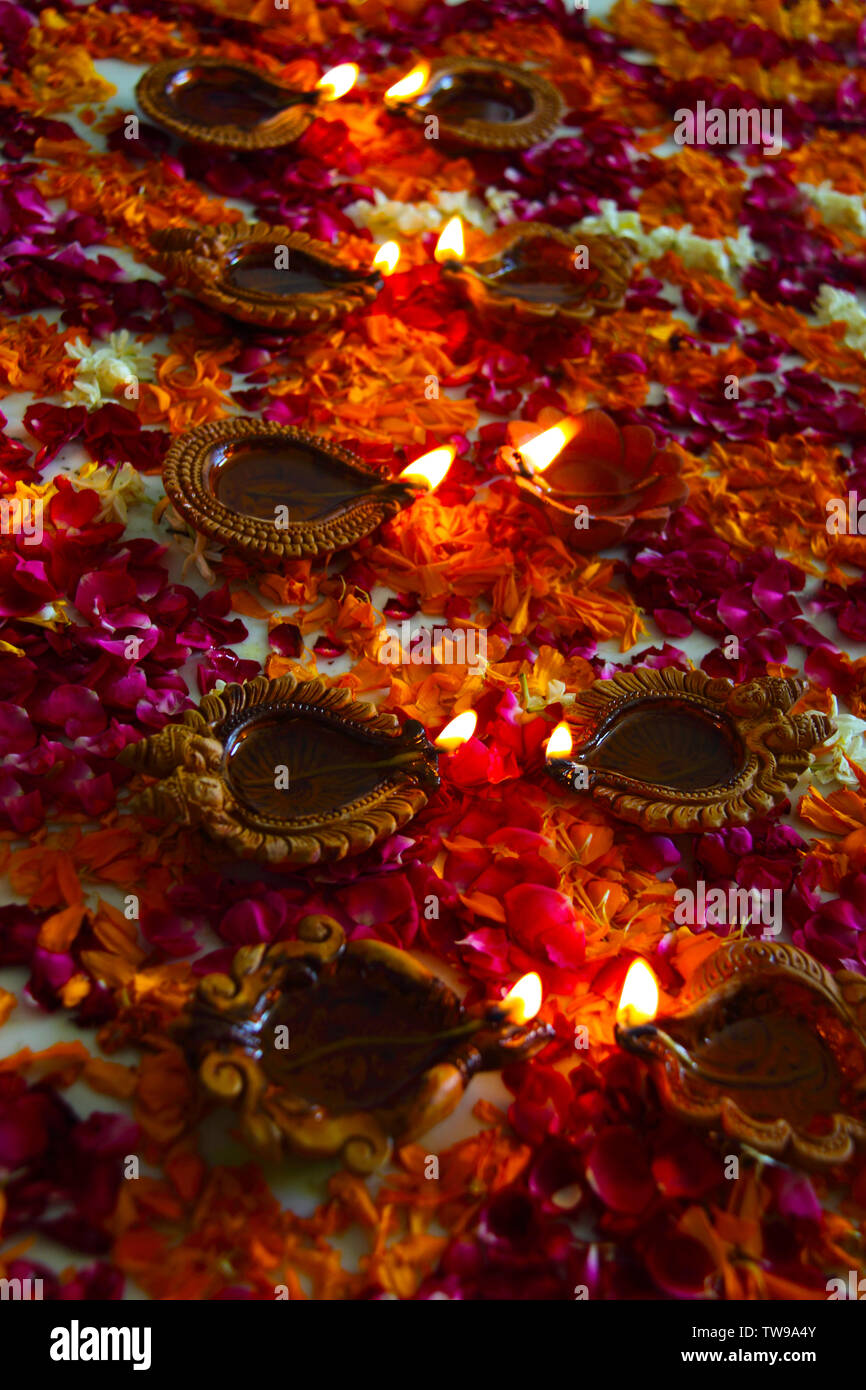 Diwali diyas burning in a row Stock Photo - Alamy