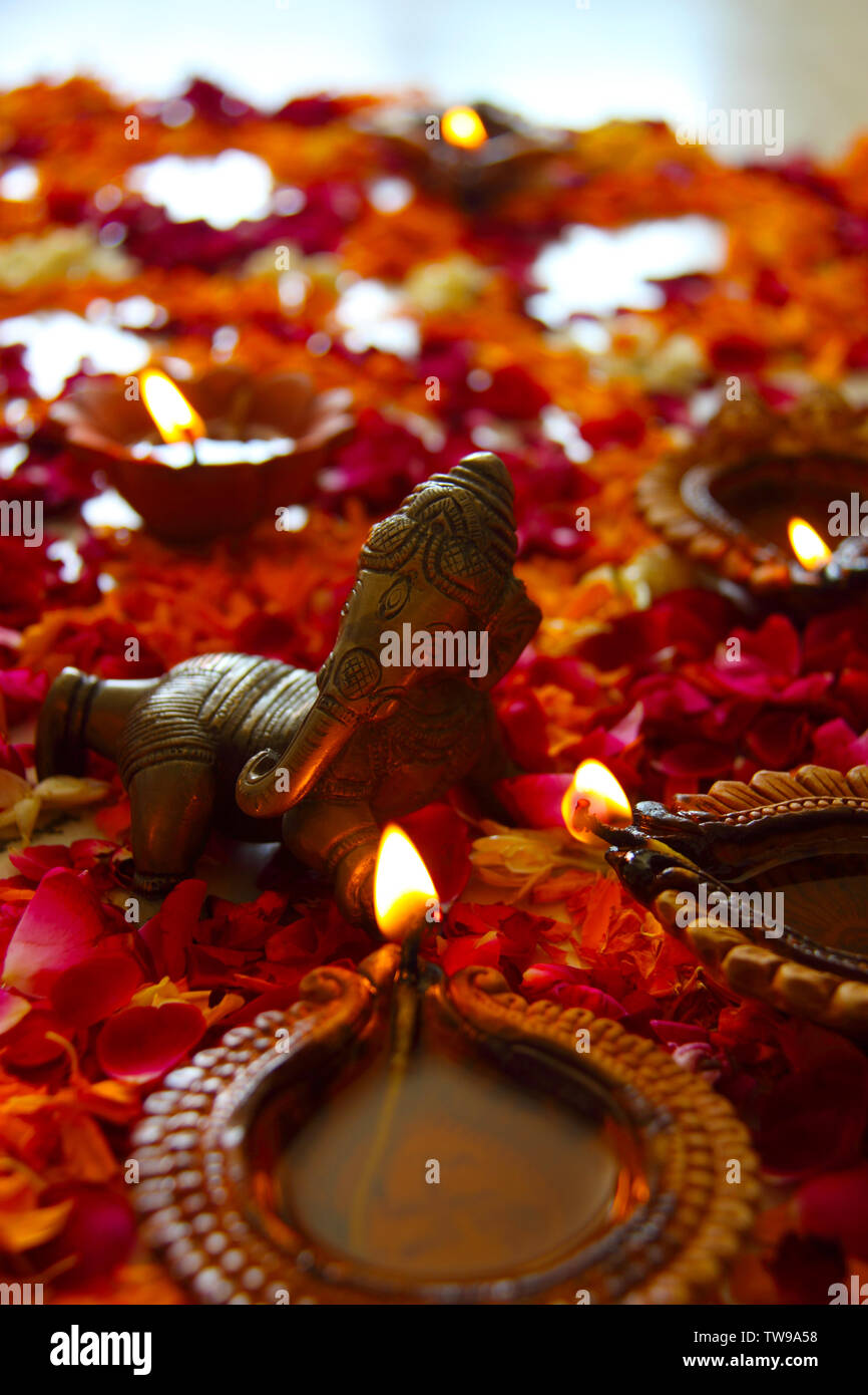 Statue of Lord Ganesha with diwali diyas Stock Photo - Alamy