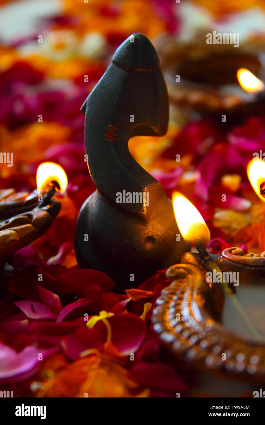 Statue of Lord Ganesha with diwali diyas Stock Photo - Alamy