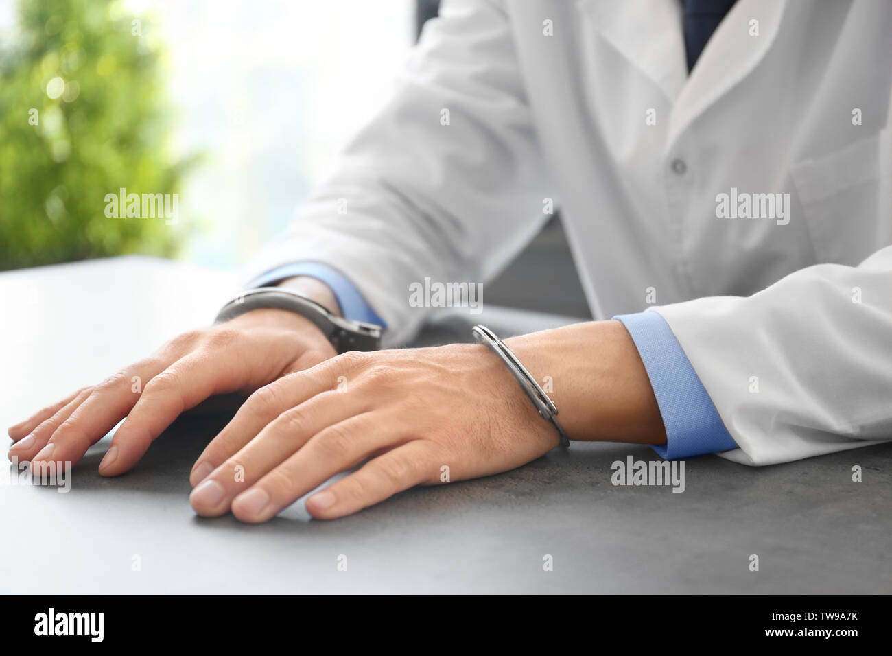 Doctor handcuffs hi-res stock photography and images - Alamy