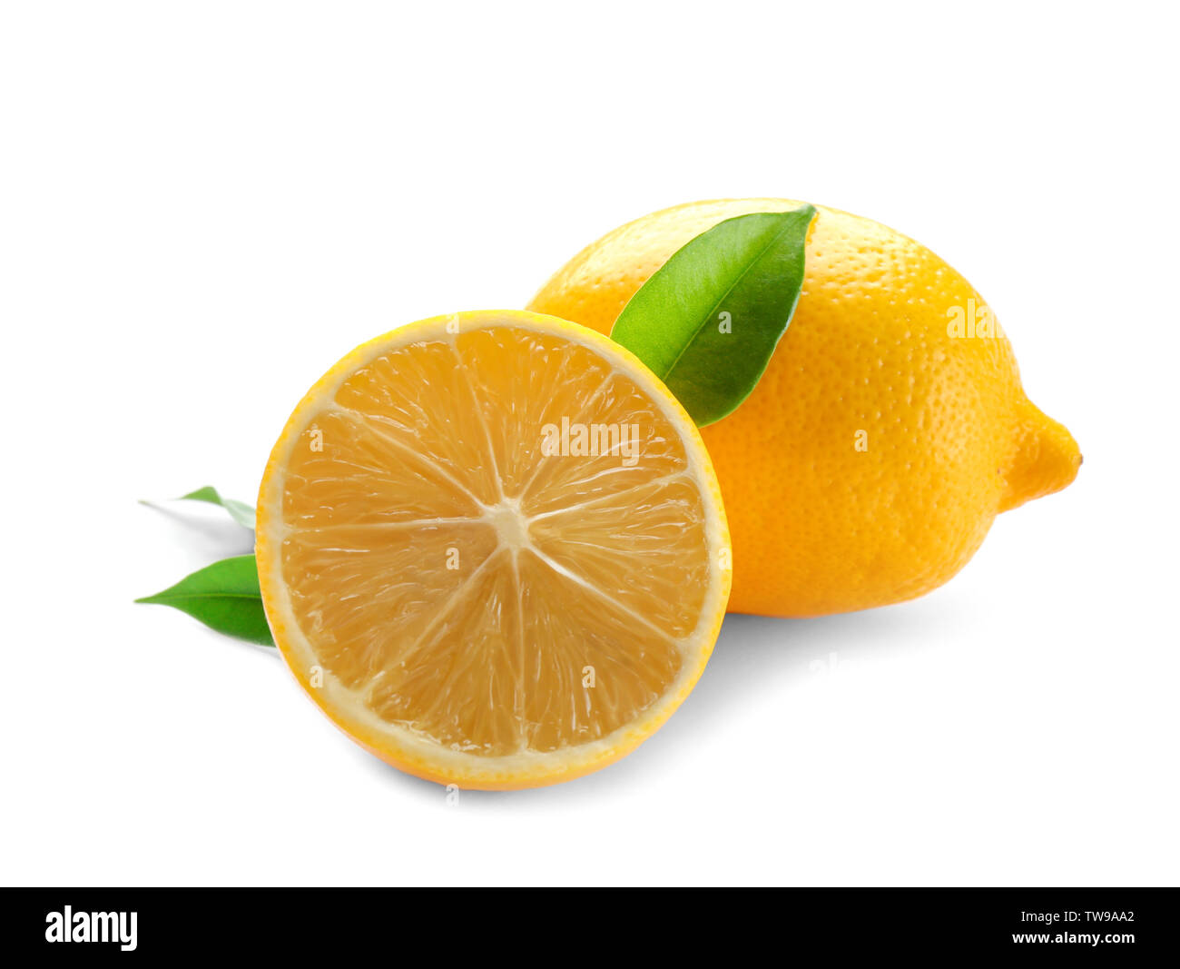 Fresh ripe lemons with leaves on white background Stock Photo - Alamy