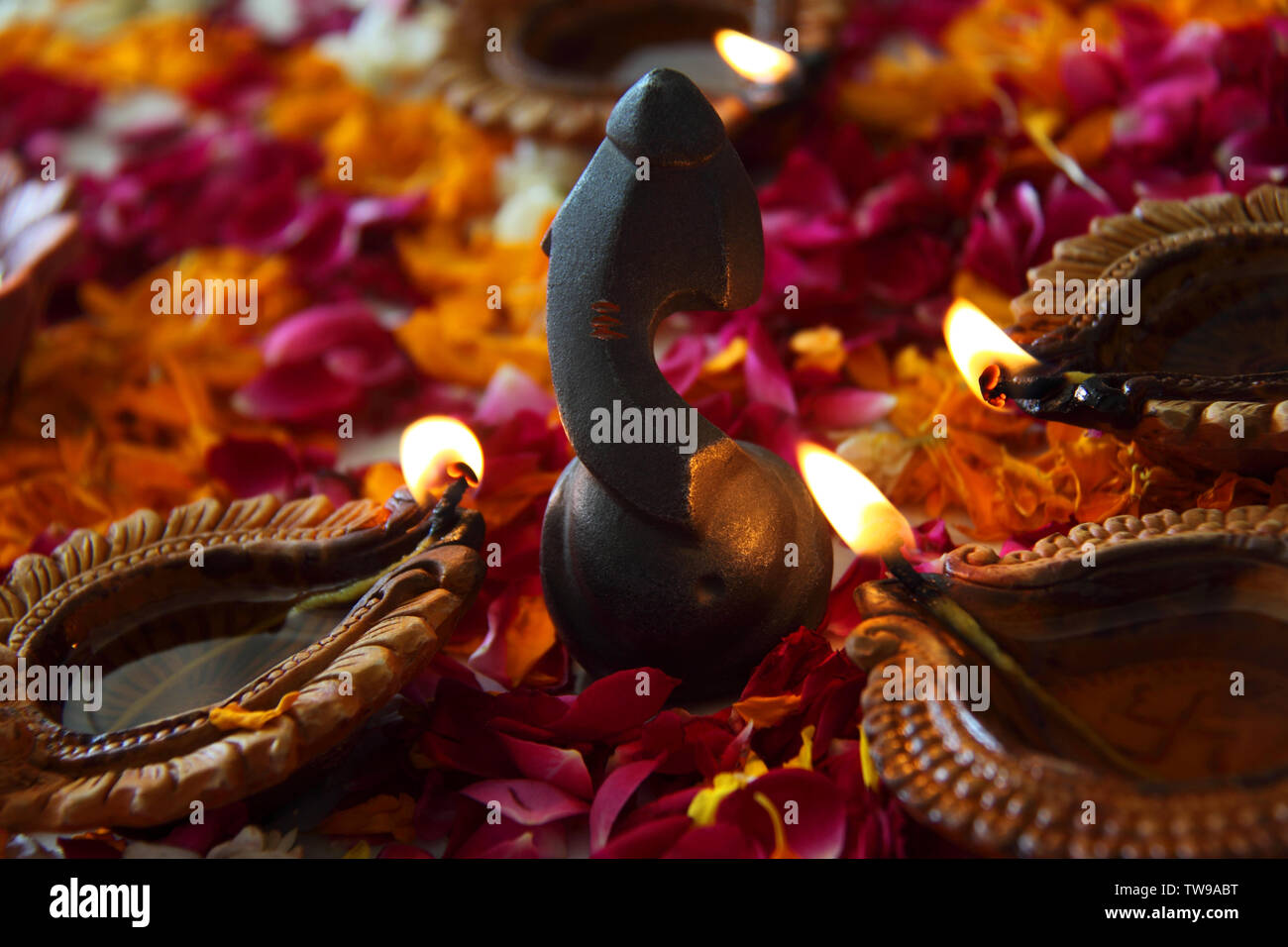 Statue of Lord Ganesha with diwali diyas Stock Photo - Alamy