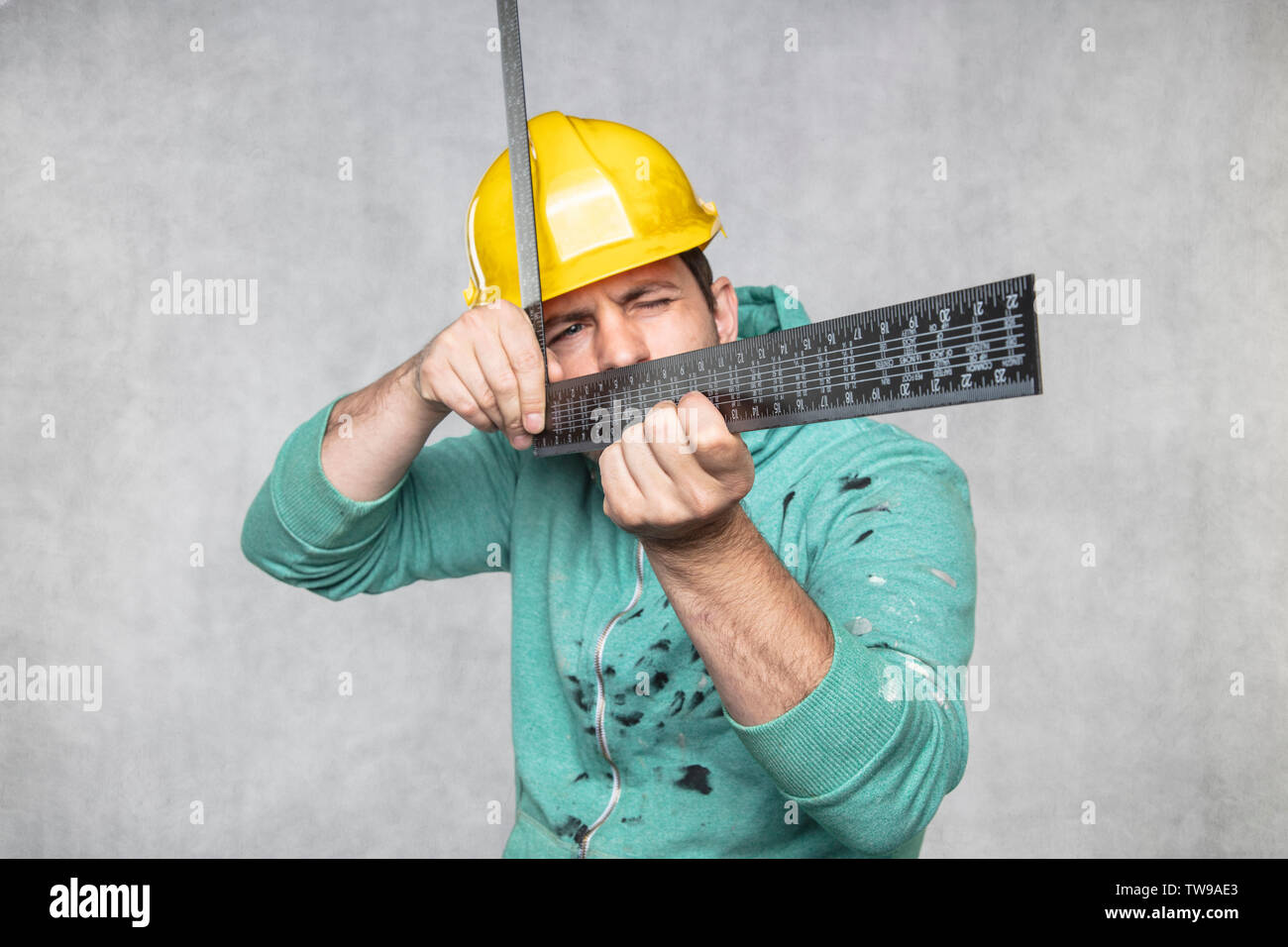 the construction worker is holding a angle in the hand, a guide to ...