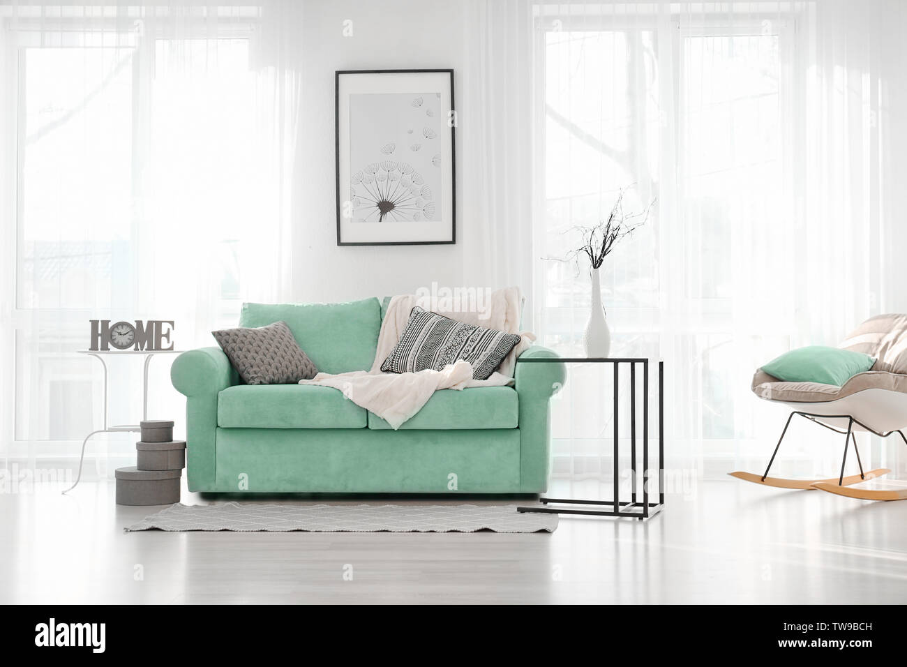 Living room interior with comfortable mint couch Stock Photo - Alamy