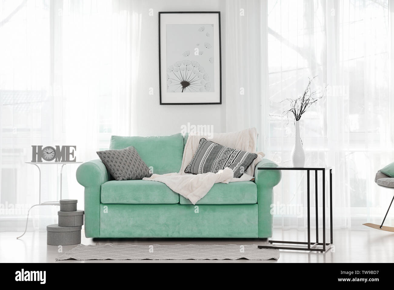 Living room interior with comfortable mint couch Stock Photo - Alamy