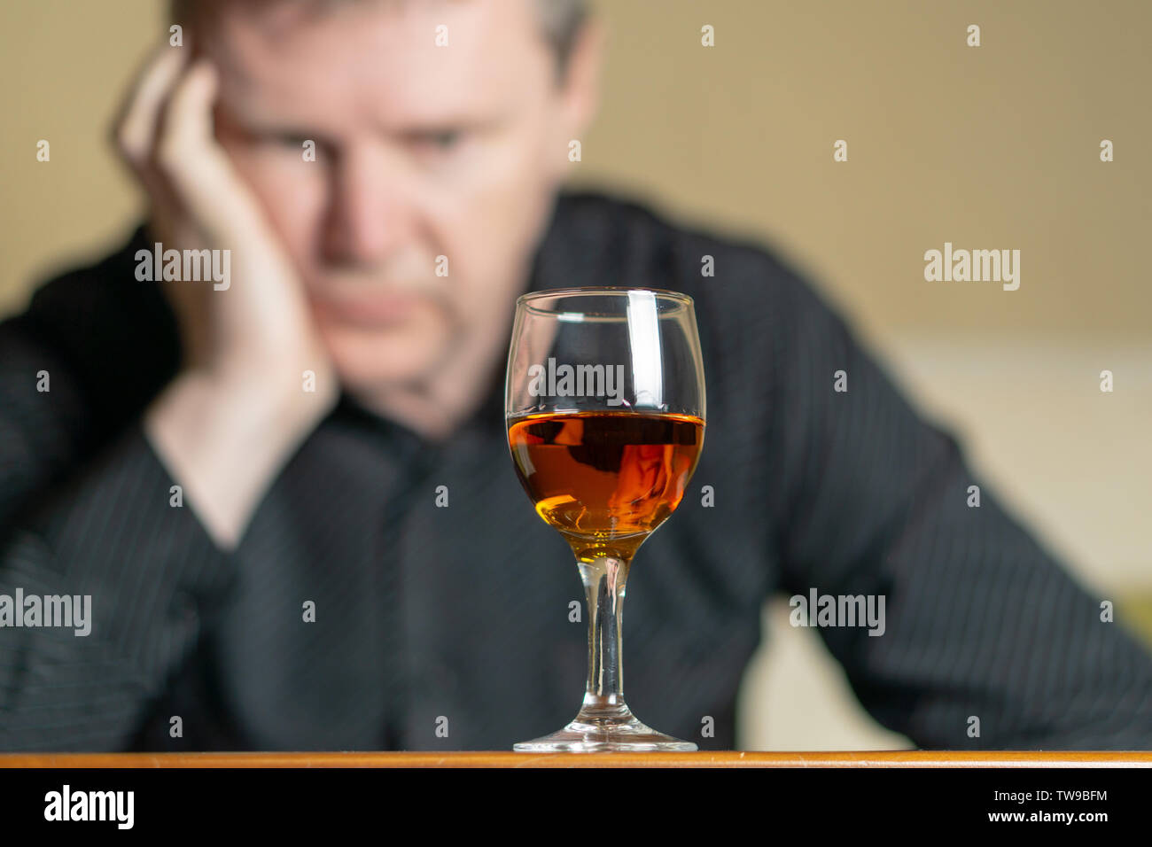 Drunk man leaning on table hi-res stock photography and images - Alamy