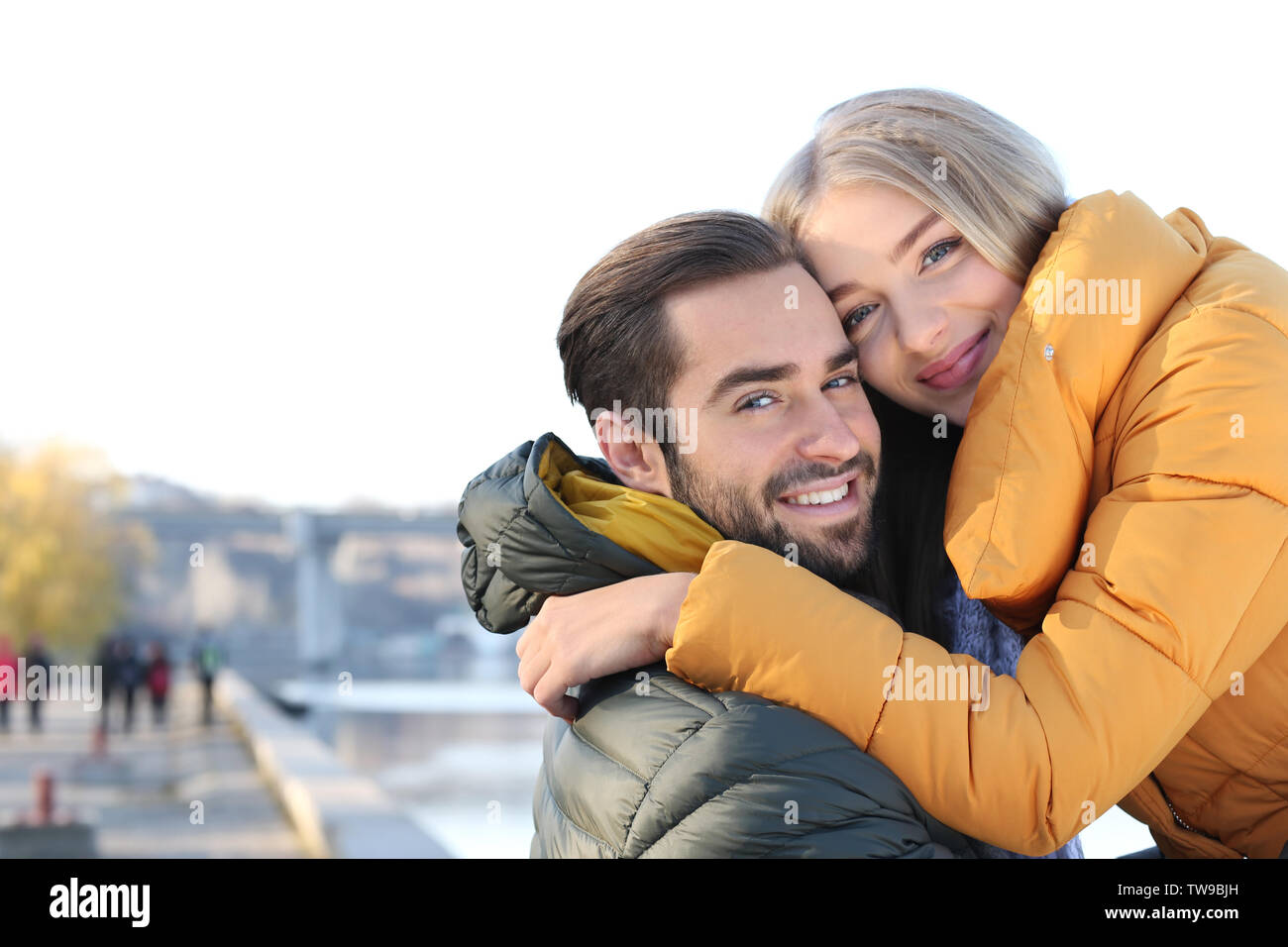 Young romantic couple hugging outdoors Stock Photo - Alamy