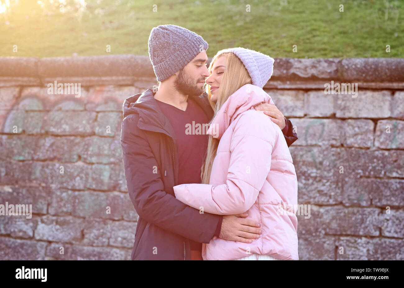 Young romantic couple hugging outdoors Stock Photo - Alamy