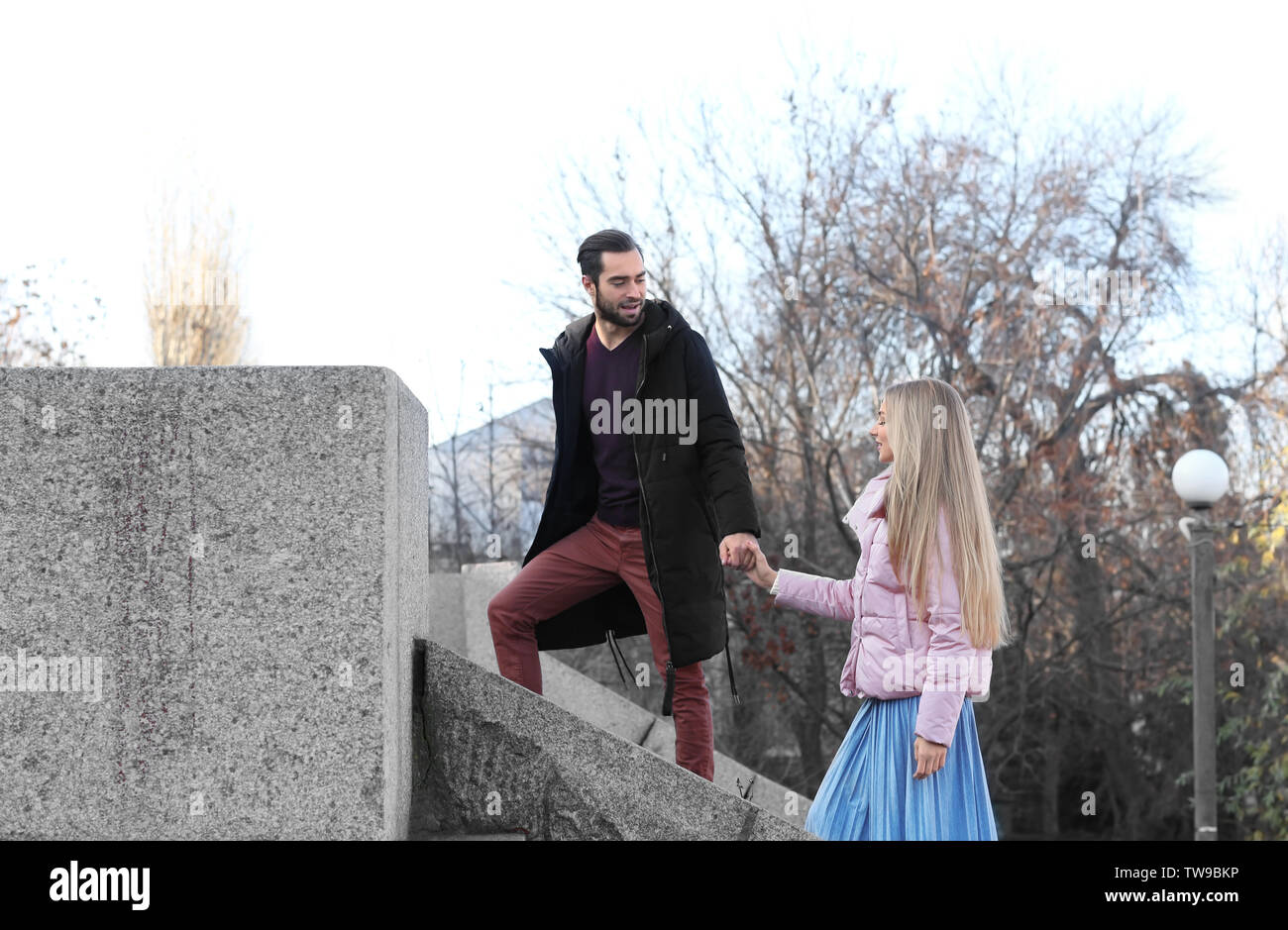 Young romantic couple on stairs outdoors Stock Photo - Alamy