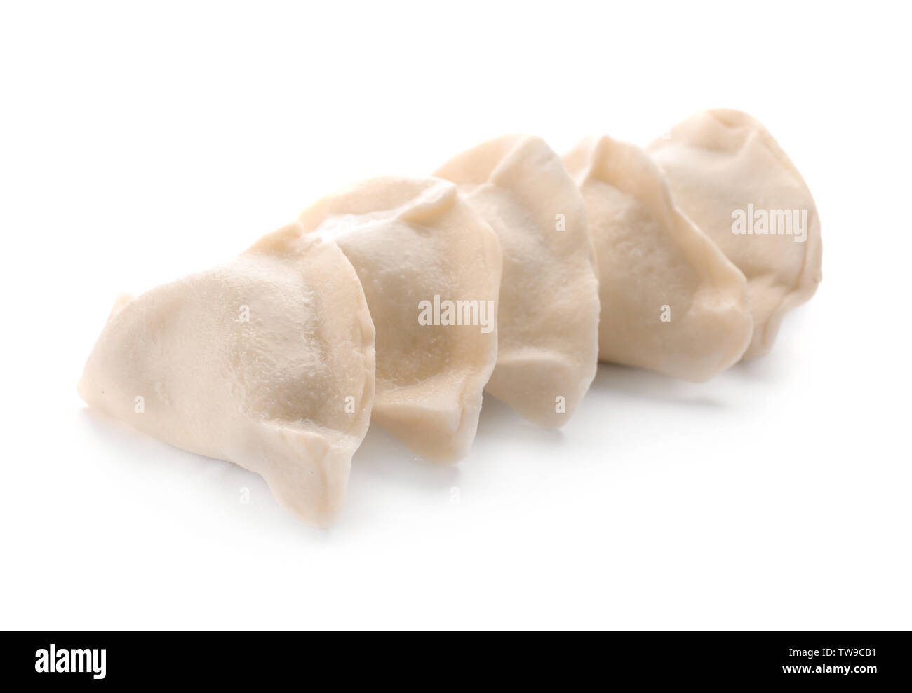 Raw dumplings on white background Stock Photo - Alamy