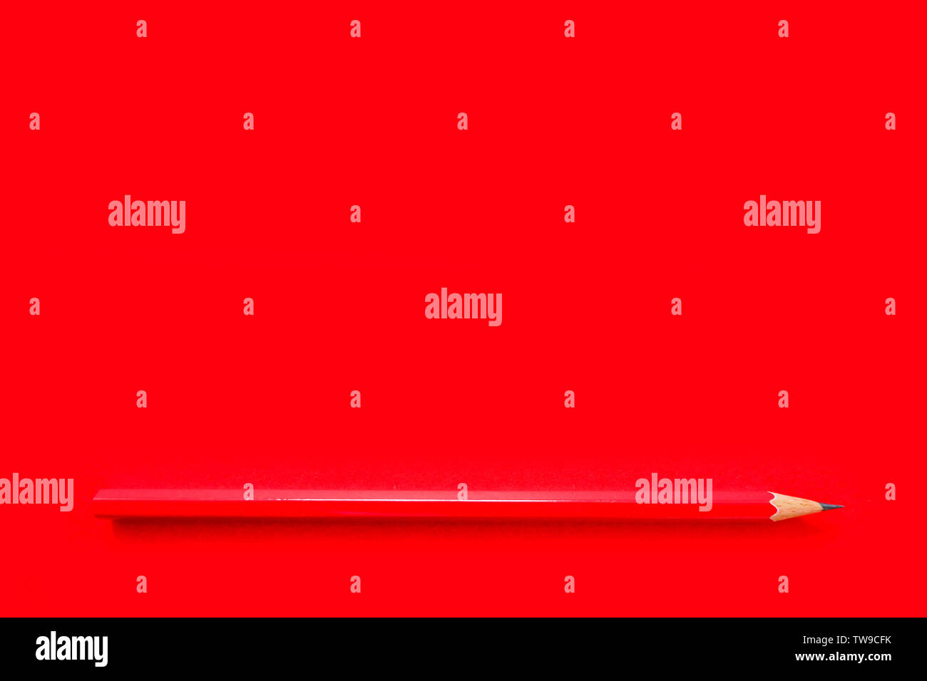 Close Up Wood Red Colored Pencil Single Object on Blank Red Paper ...