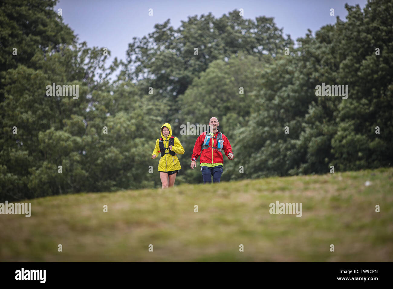 Two Ultra Marathon runners run together during an 24 hour trail ...
