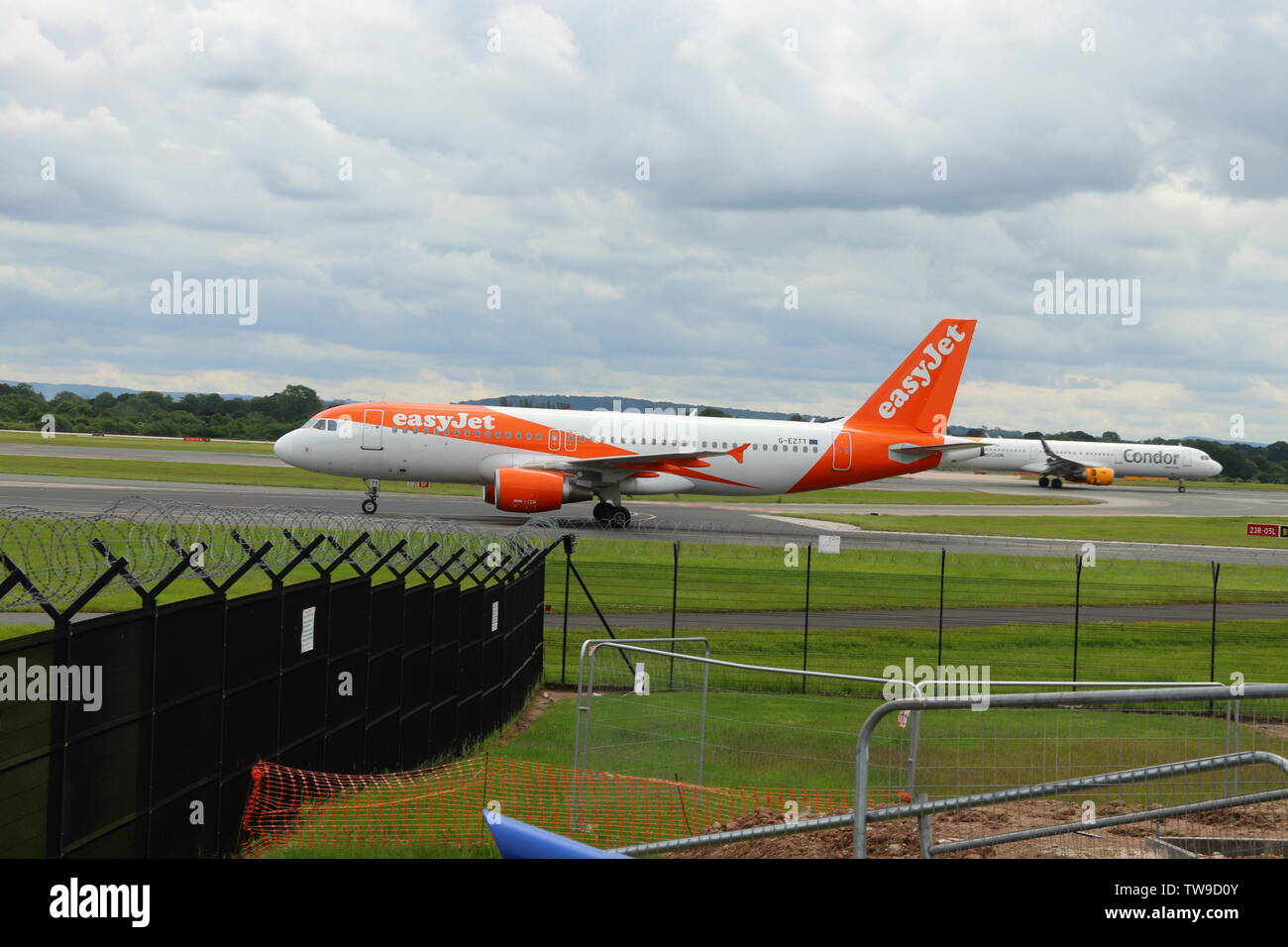 Families visiting Manchester airport's runway visitor park watching the ...