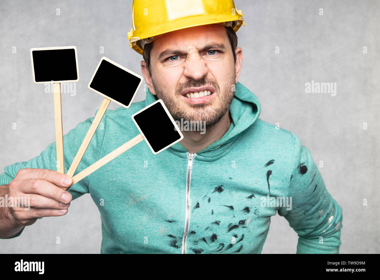 Angry construction worker holding hi-res stock photography and images ...