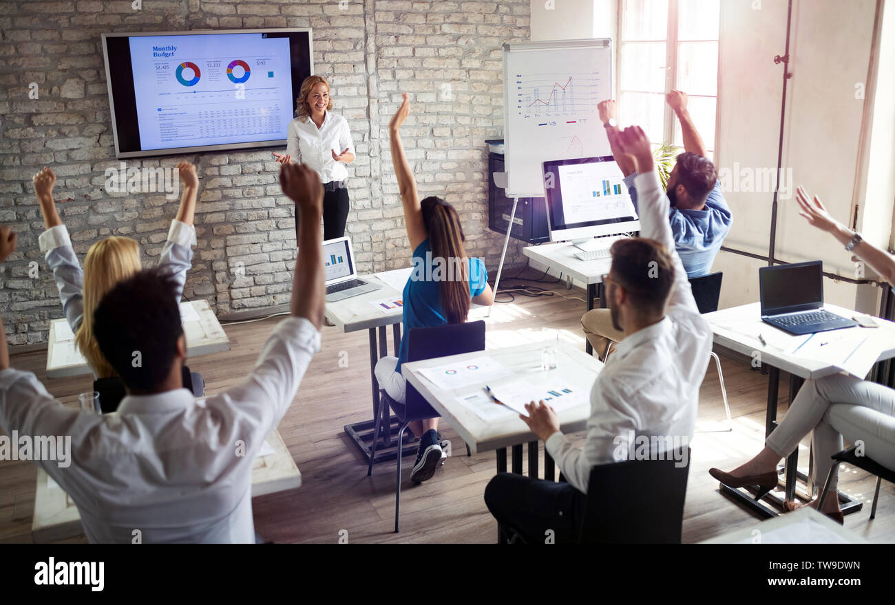 Successful happy group of people learning software engineering and ...