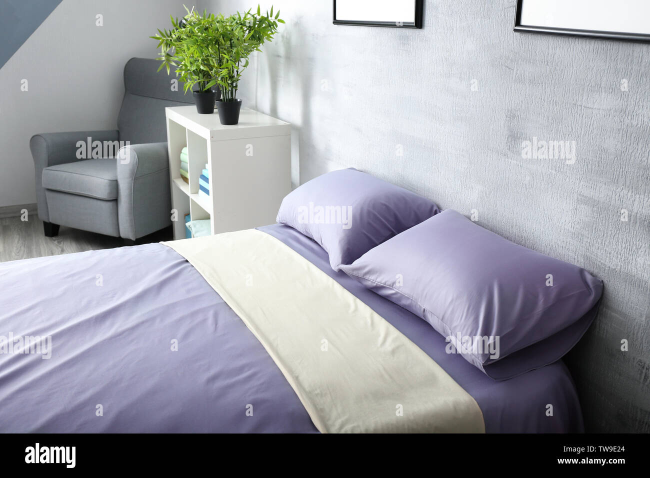 Cozy room interior with comfortable bed, closeup Stock Photo - Alamy