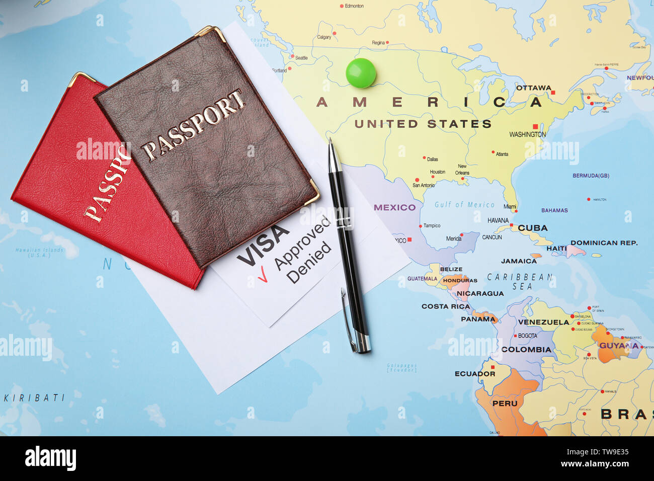 Passports and pen on map. Approved American visa Stock Photo - Alamy
