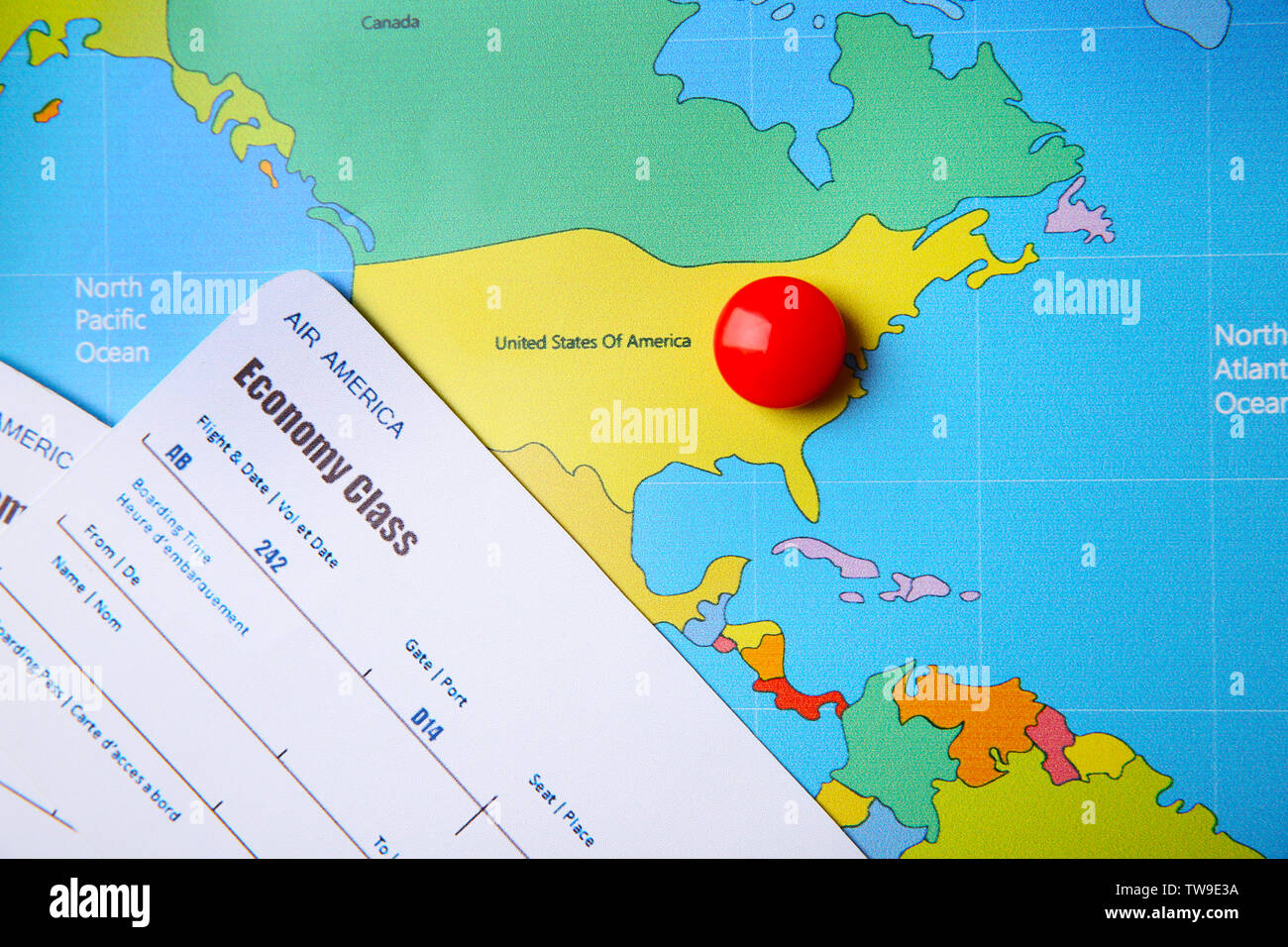 Tickets on world map. American visa concept Stock Photo - Alamy