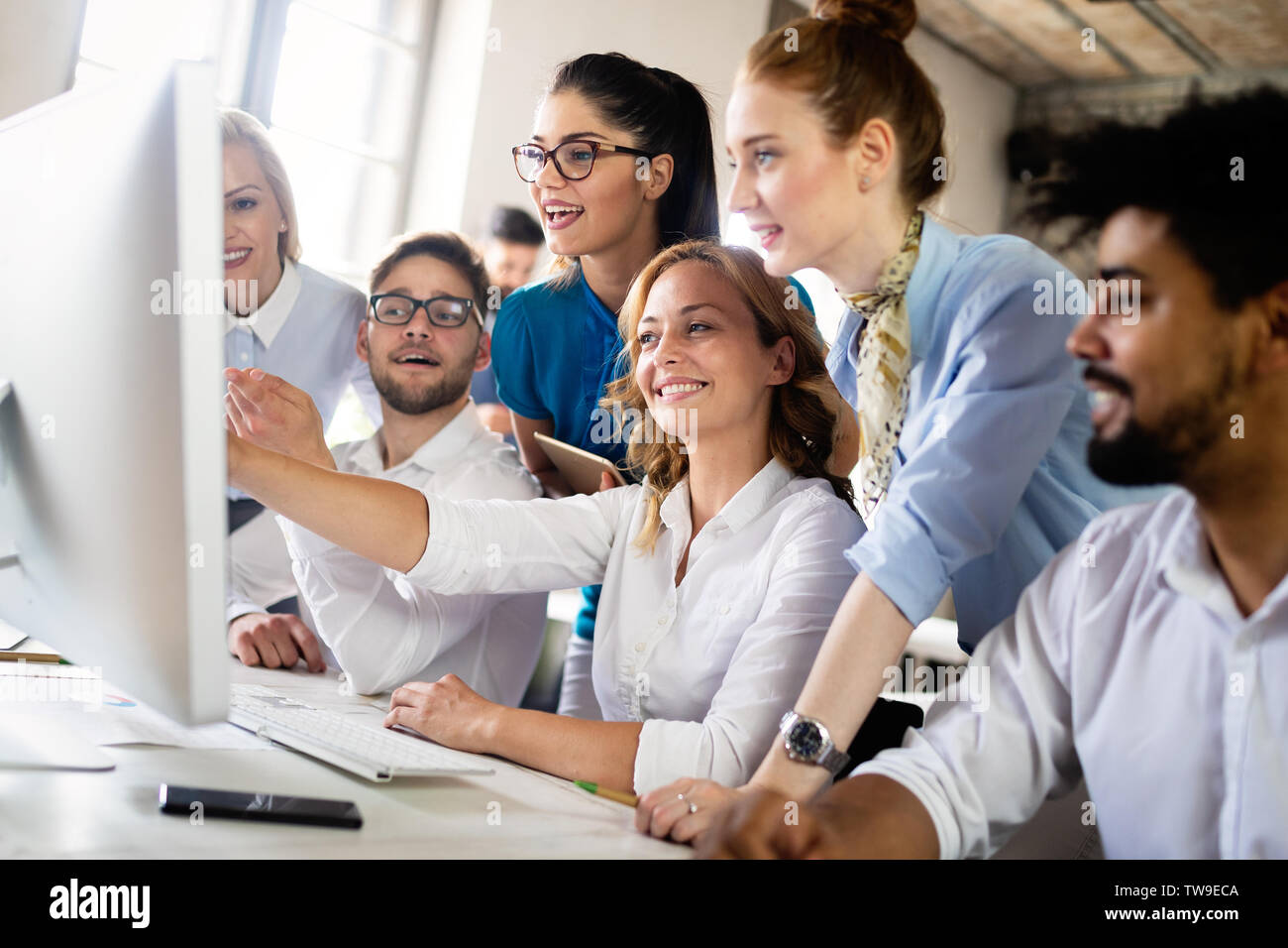 Happy creative team in office. Business, startup, design, people and ...